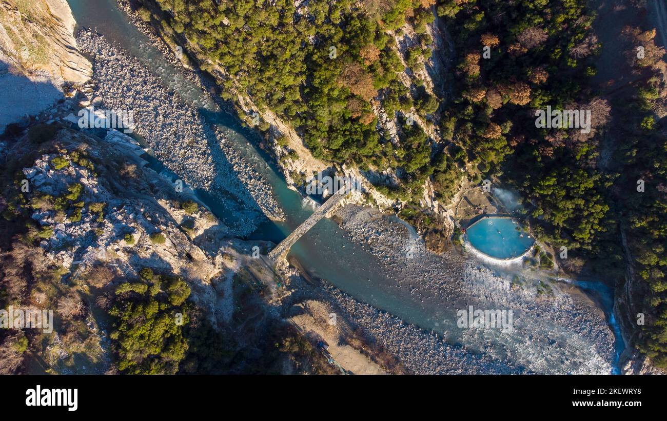 Aerial drone view of people swimming and bathing in hot springs thermal ...