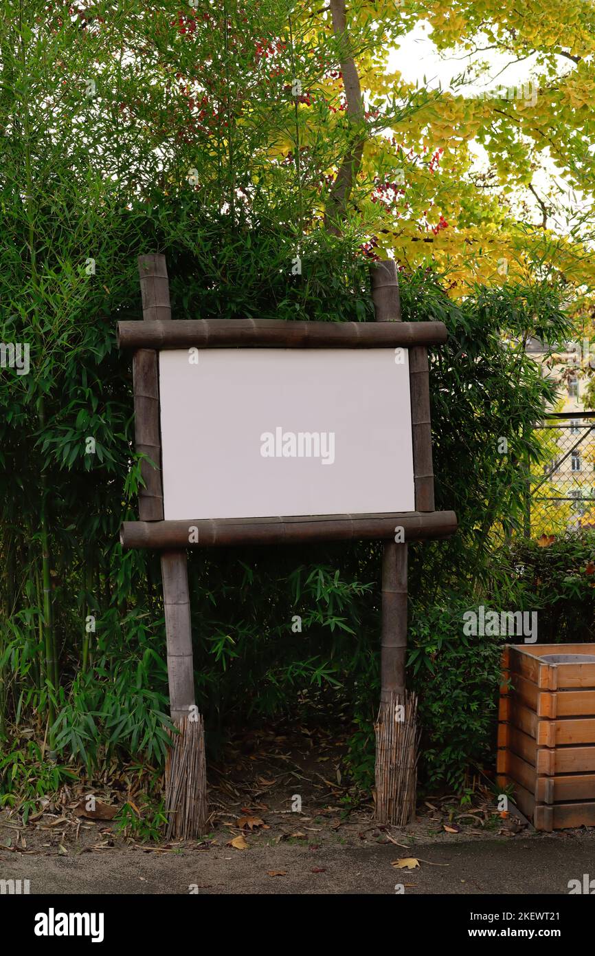 Blank bamboo signboard in autumn park Stock Photo - Alamy