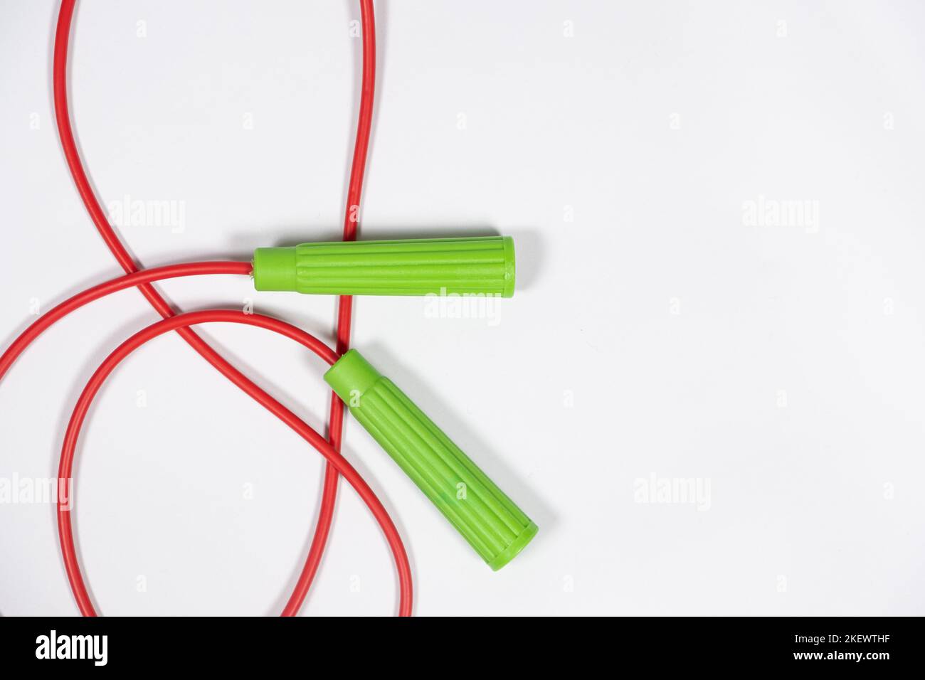 Red green rope on white background close-up Stock Photo - Alamy