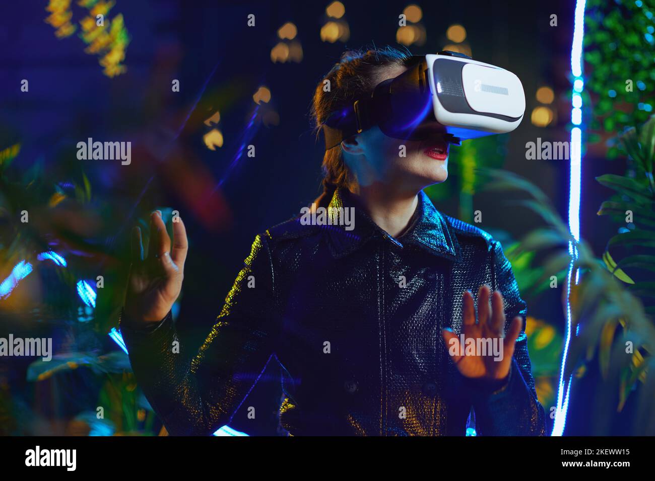 modern middle aged woman in metaverse in vr goggles exploring Stock ...
