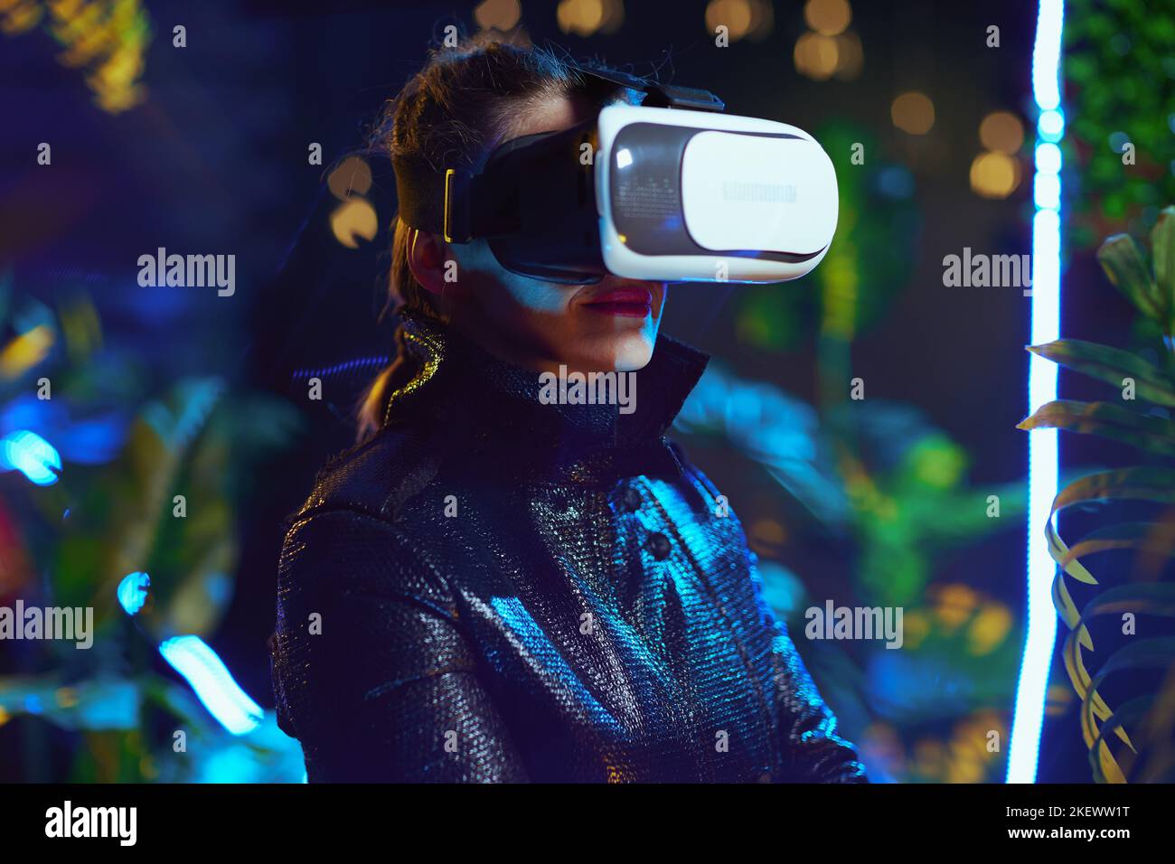Portrait of modern woman in metaverse in vr headset Stock Photo - Alamy