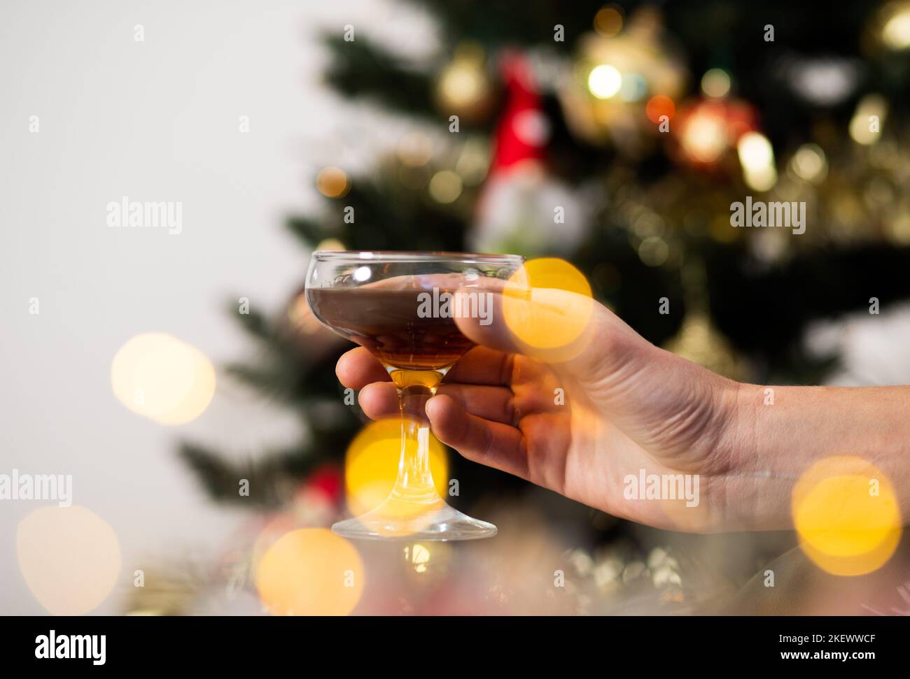woman holding liquor in hand celebration Stock Photo - Alamy
