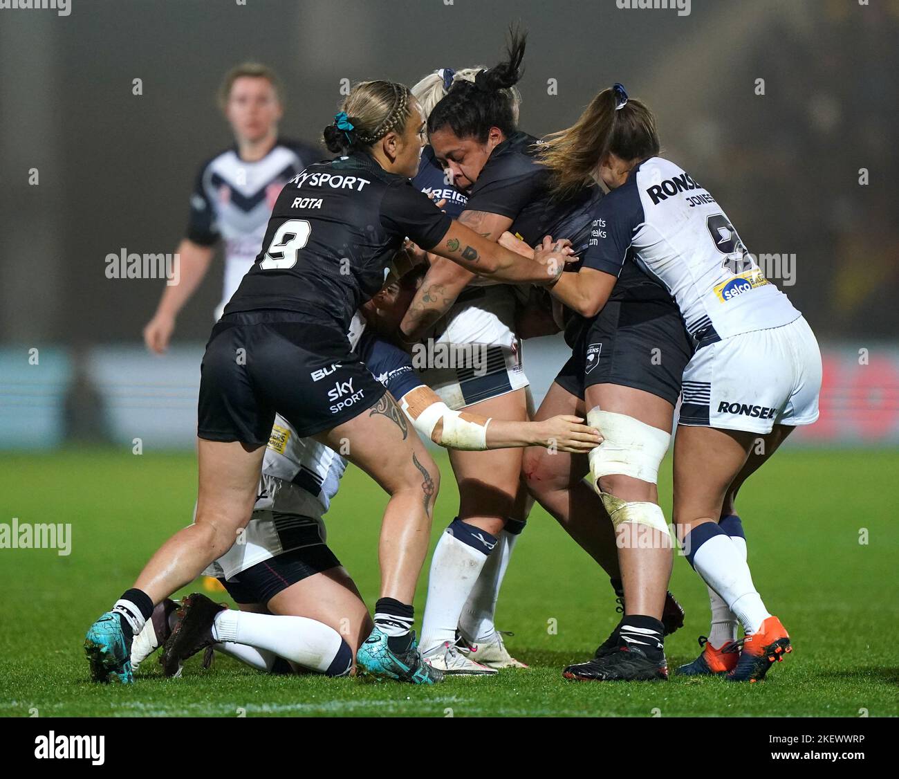 England's Dannielle Anderson (centre) and Tara Jones (right) battle ...