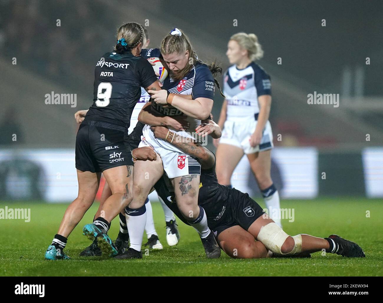 England's Vicky Whitfield (centre) is tackled by New Zealand's Krystal ...