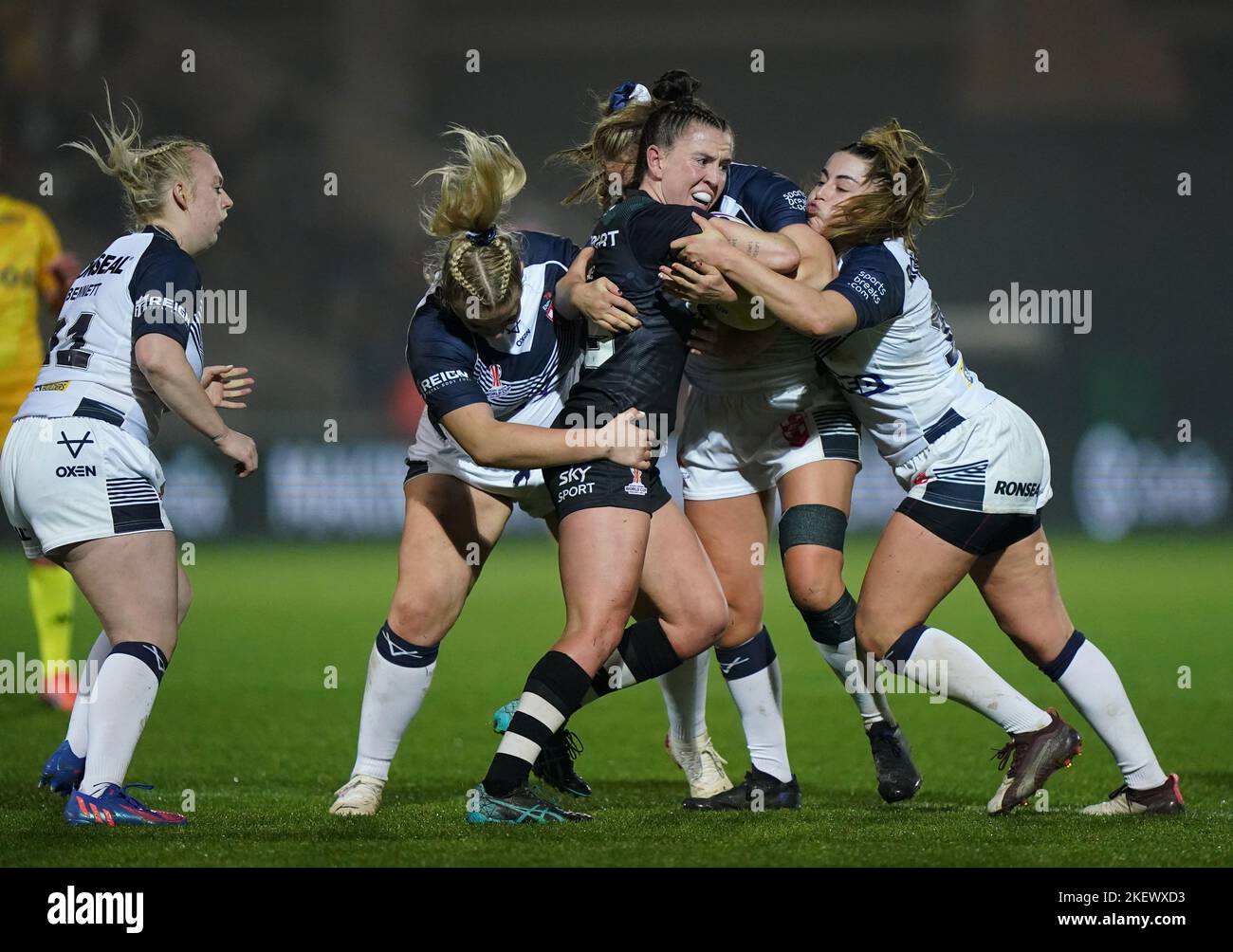 New Zealand's Georgia Hale (centre) battles with England's Emily Rudge ...