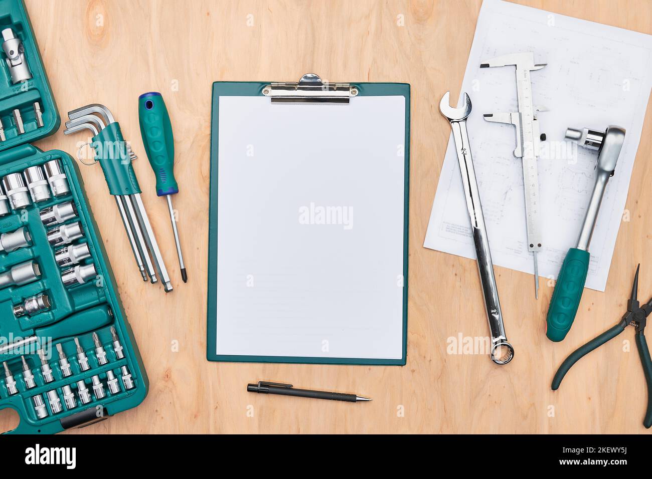 Workshop table with many tools. Wrench, spanner, calliper and ratchet ...