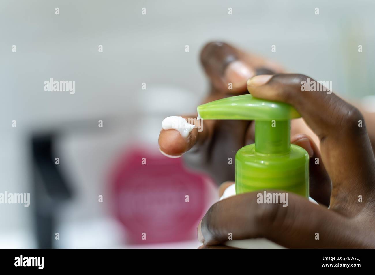 African american putting lotion on hi-res stock photography and images ...