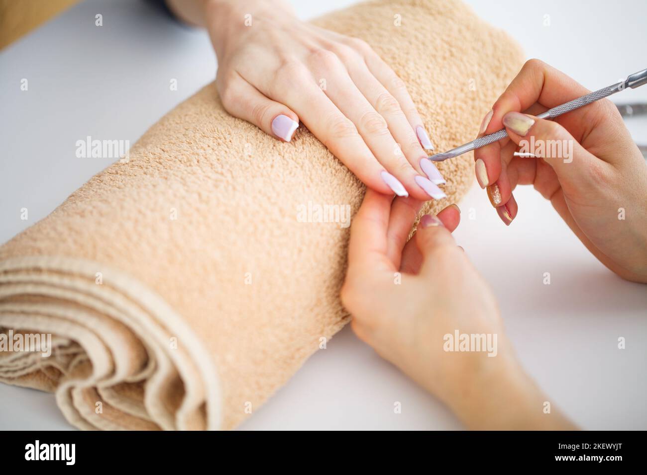 SPA manicure. French manicure at spa salon. Woman hands in a nail salon ...