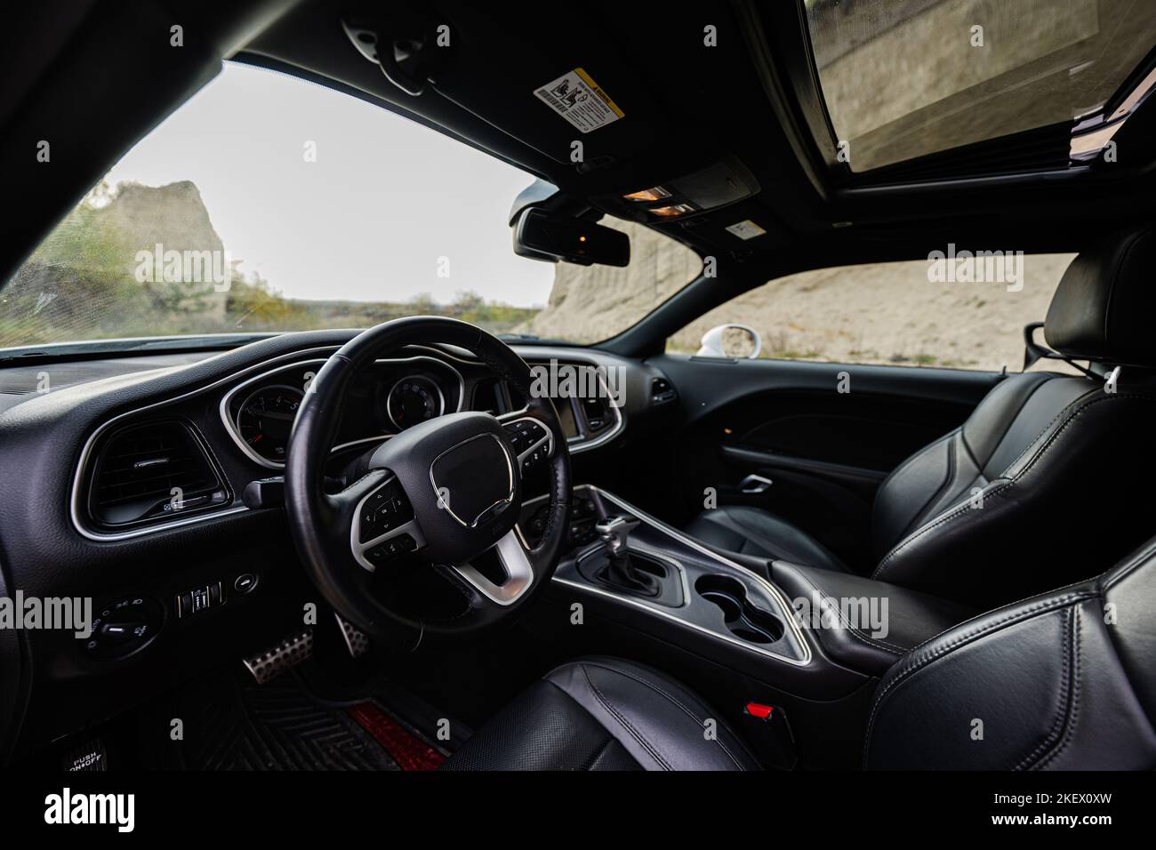Interior of the muscle car. Black leather chairs Stock Photo - Alamy