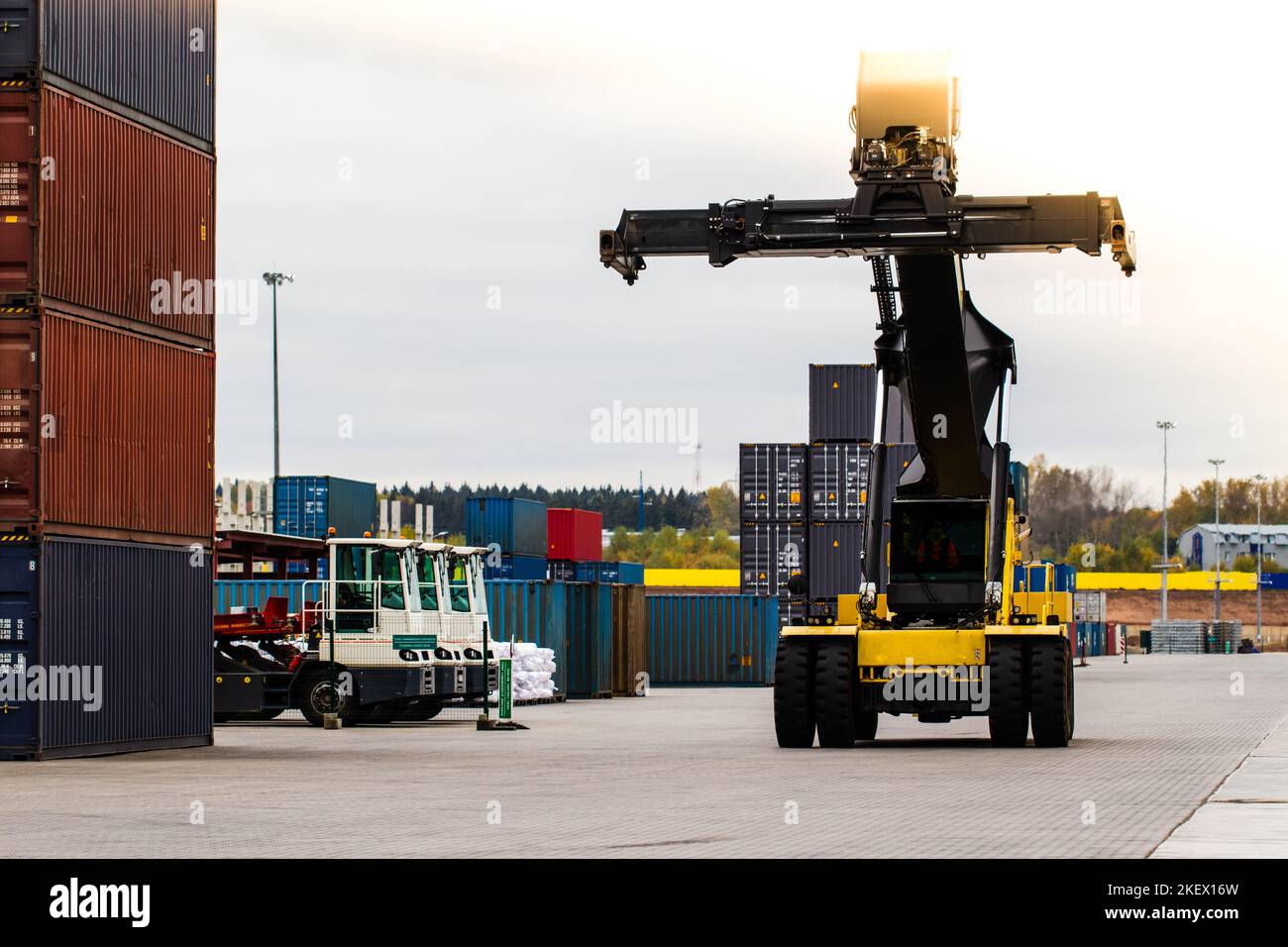 Forklift handling cargo container. Freight container loading. Container ...