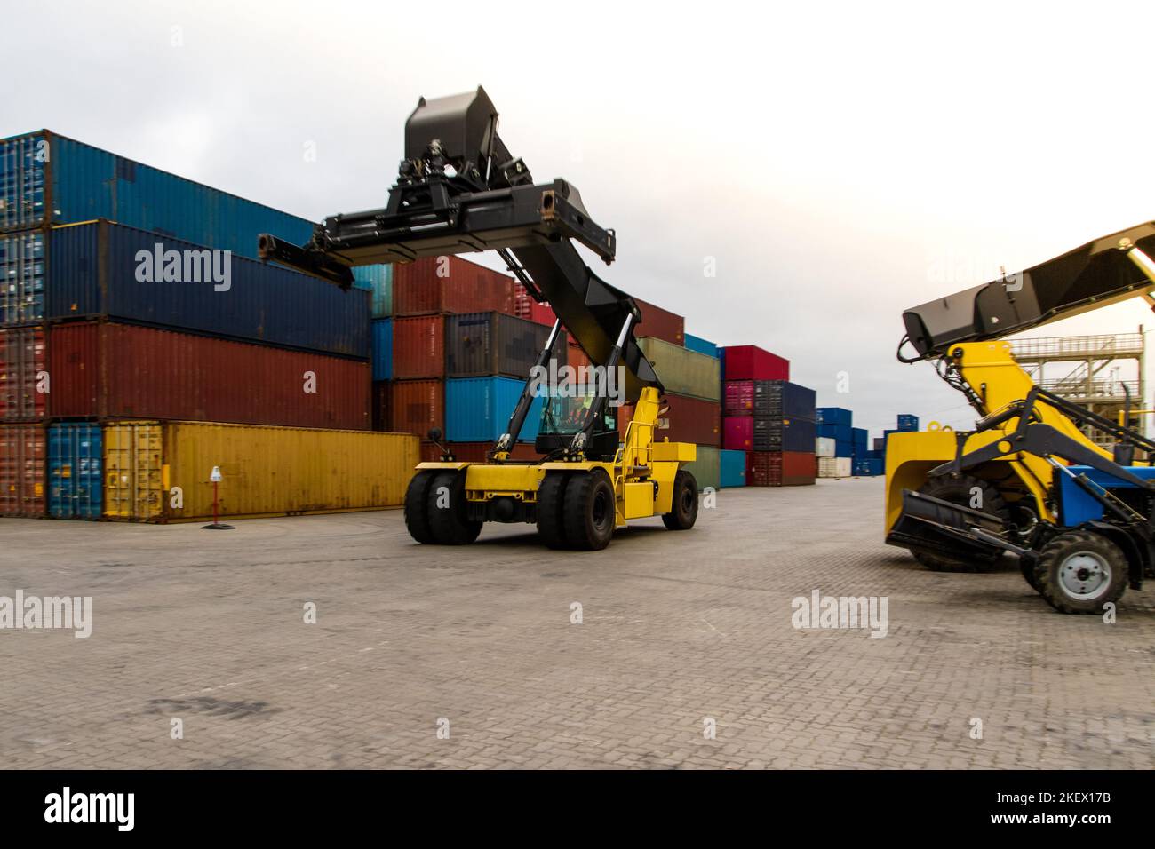 Forklift handling cargo container. Freight container loading. Container ...