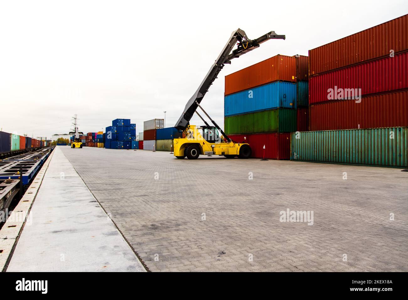 Forklift handling cargo container. Freight container loading. Container ... Forklift handling cargo container. Freight container loading. Container ...