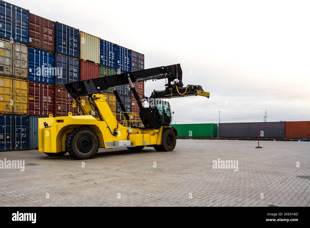 Container handlers. Forklift truck in shipping yard. Industrial ... Container handlers. Forklift truck in shipping yard. Industrial ...