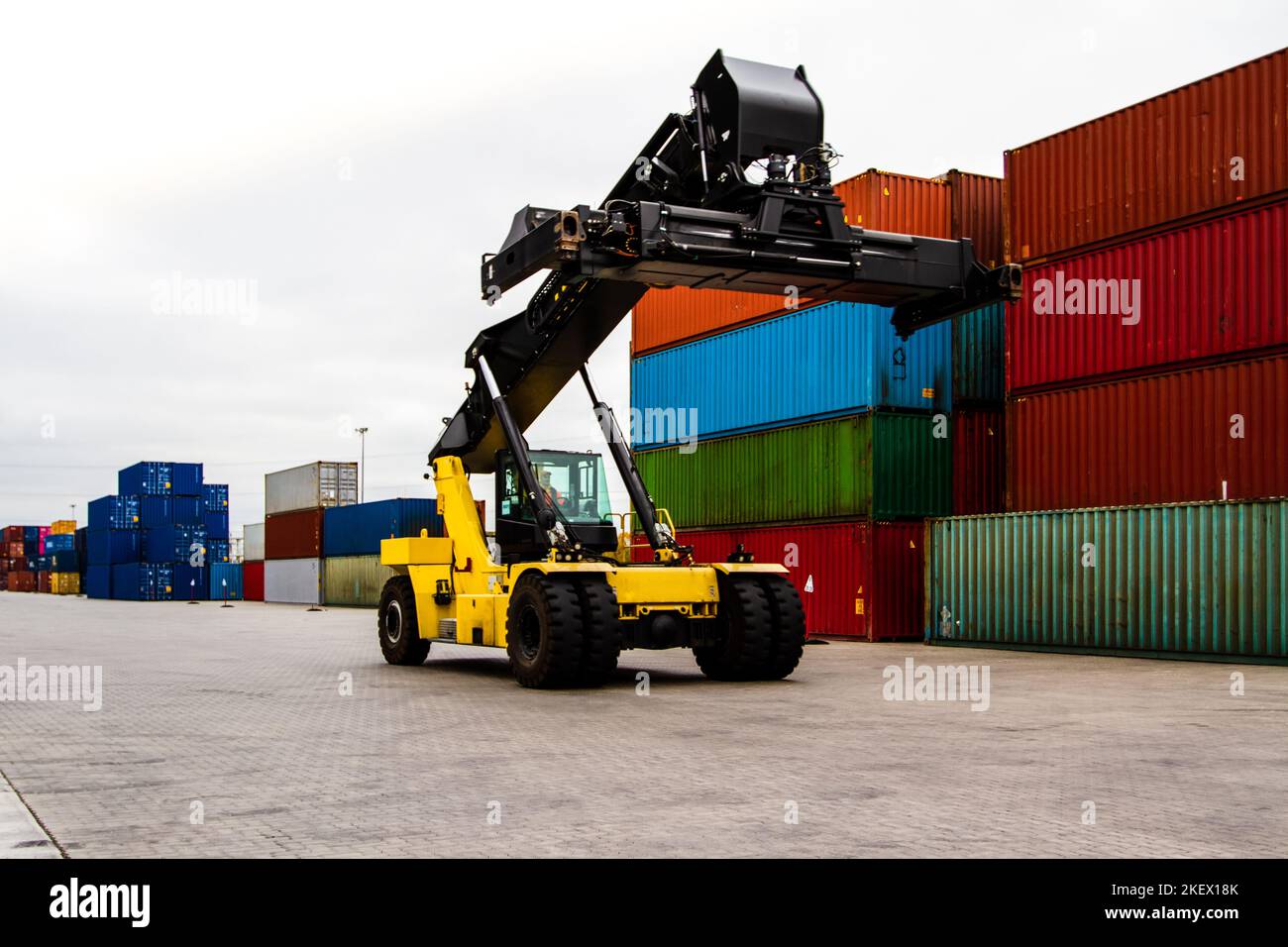 Forklift handling cargo container. Freight container loading. Container ... Forklift handling cargo container. Freight container loading. Container ...