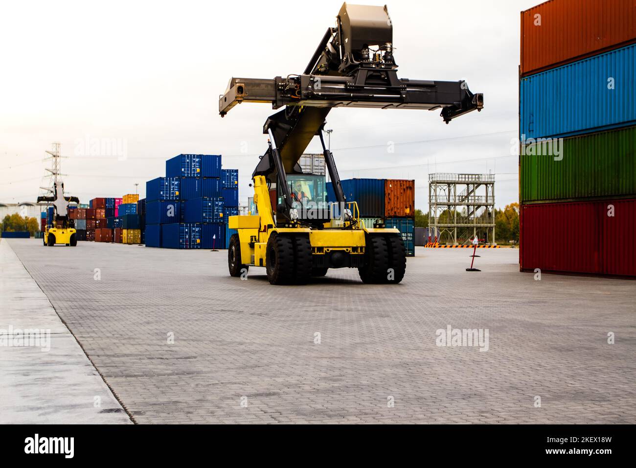 Forklift handling cargo container. Freight container loading. Container ...