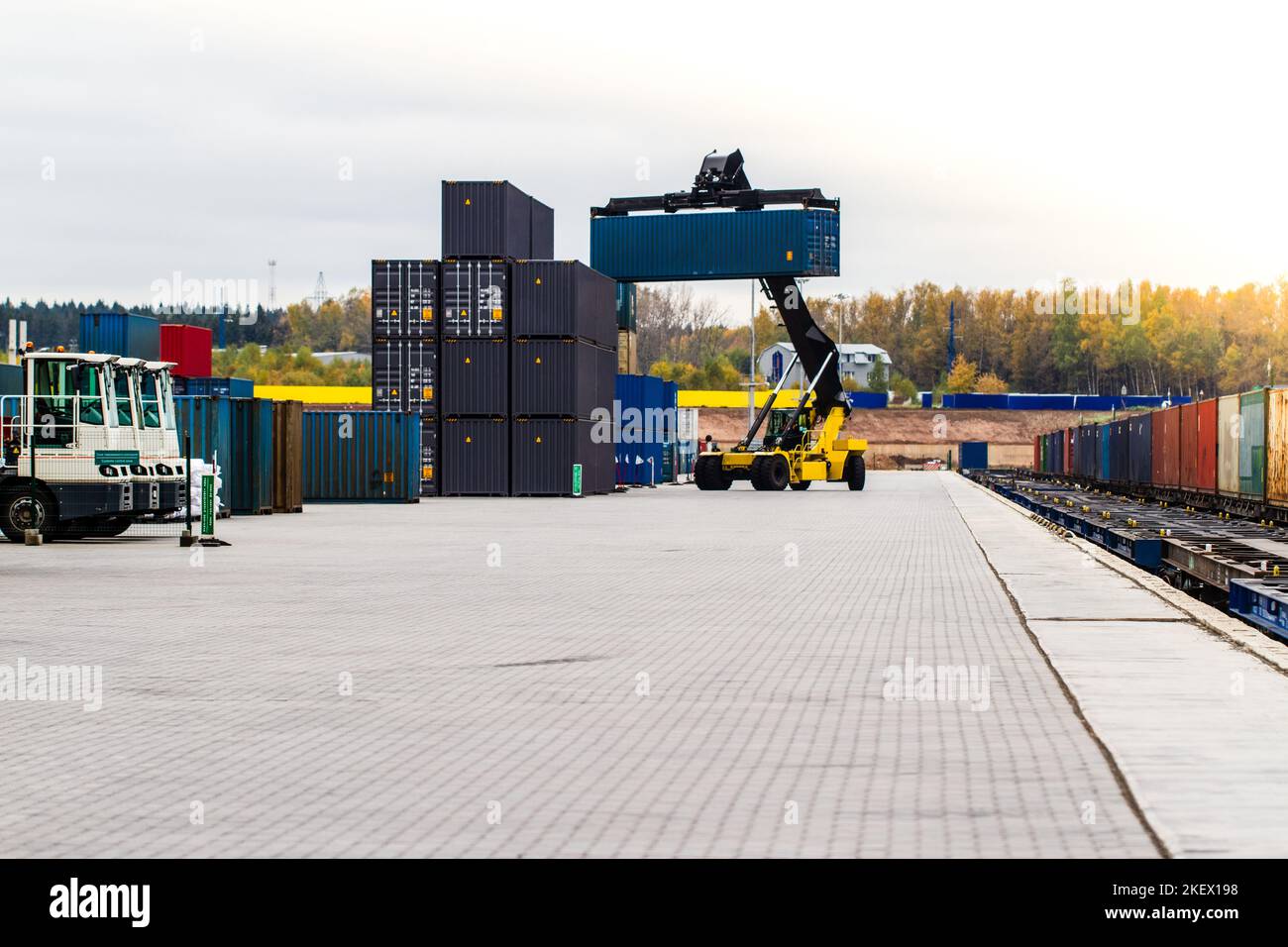Forklift handling cargo container. Freight container loading. Container ...