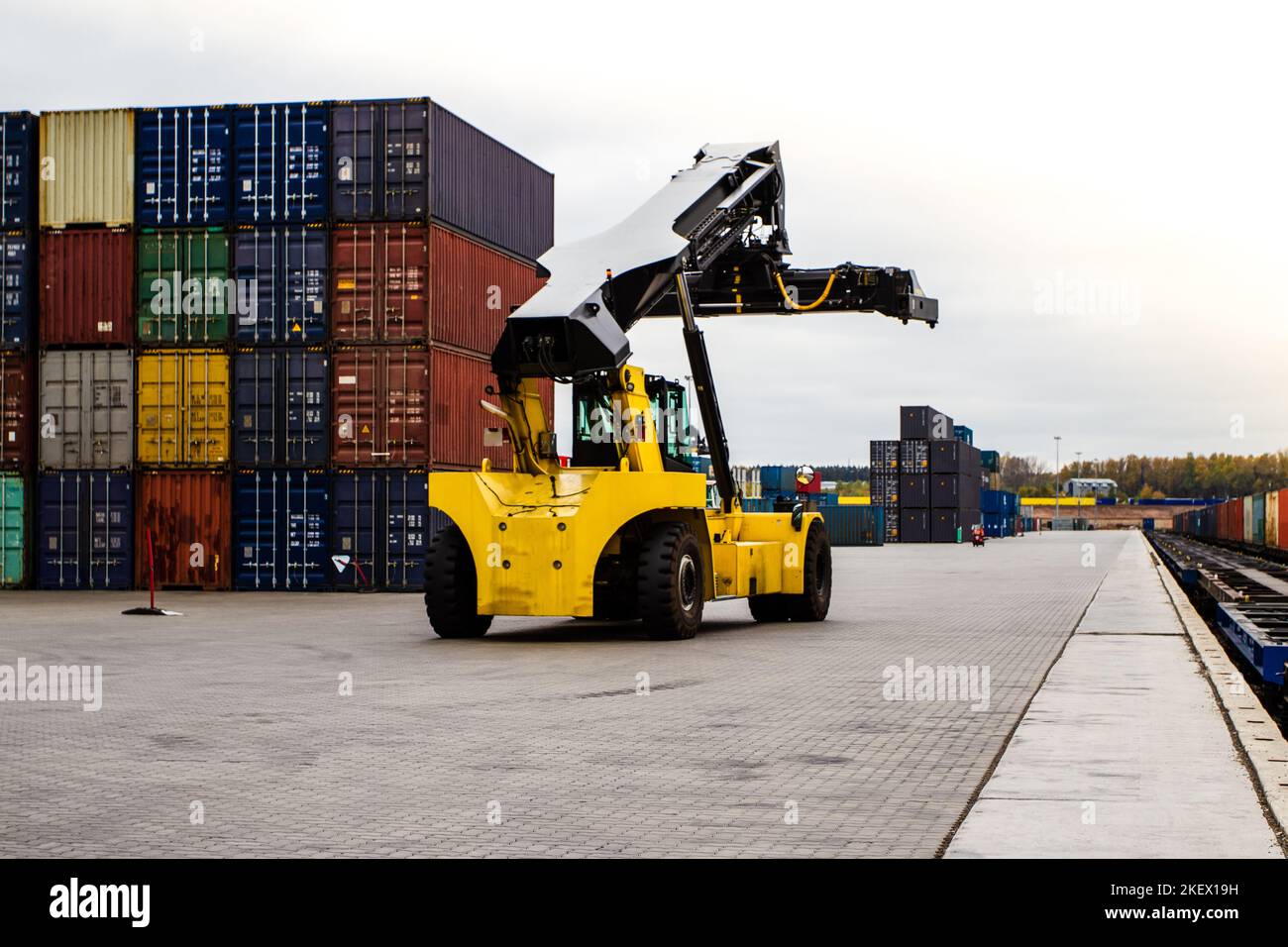 Forklift handling cargo container. Freight container loading. Container ...
