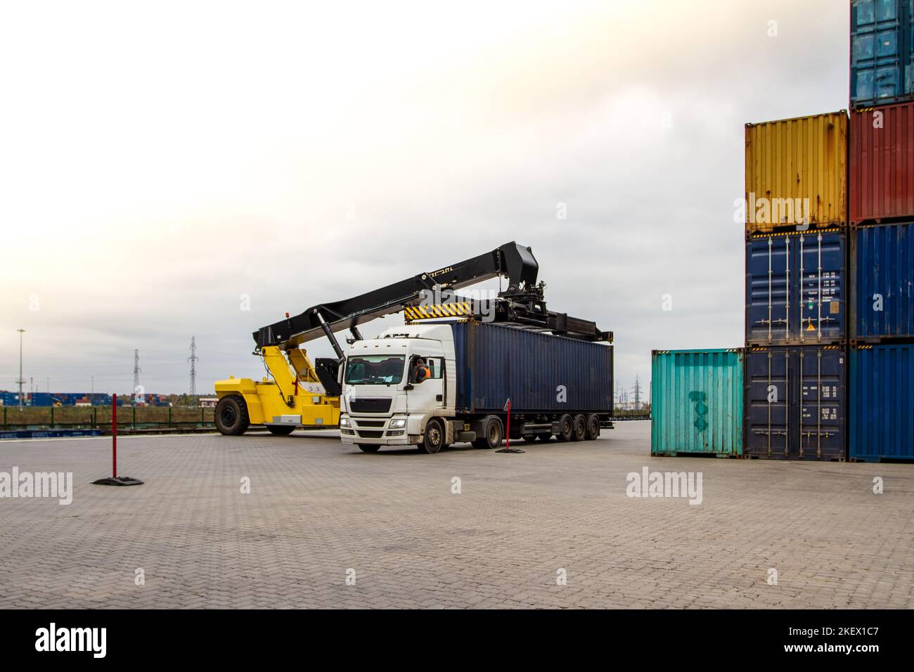 Forklift handling cargo container. Freight container loading. Container ...