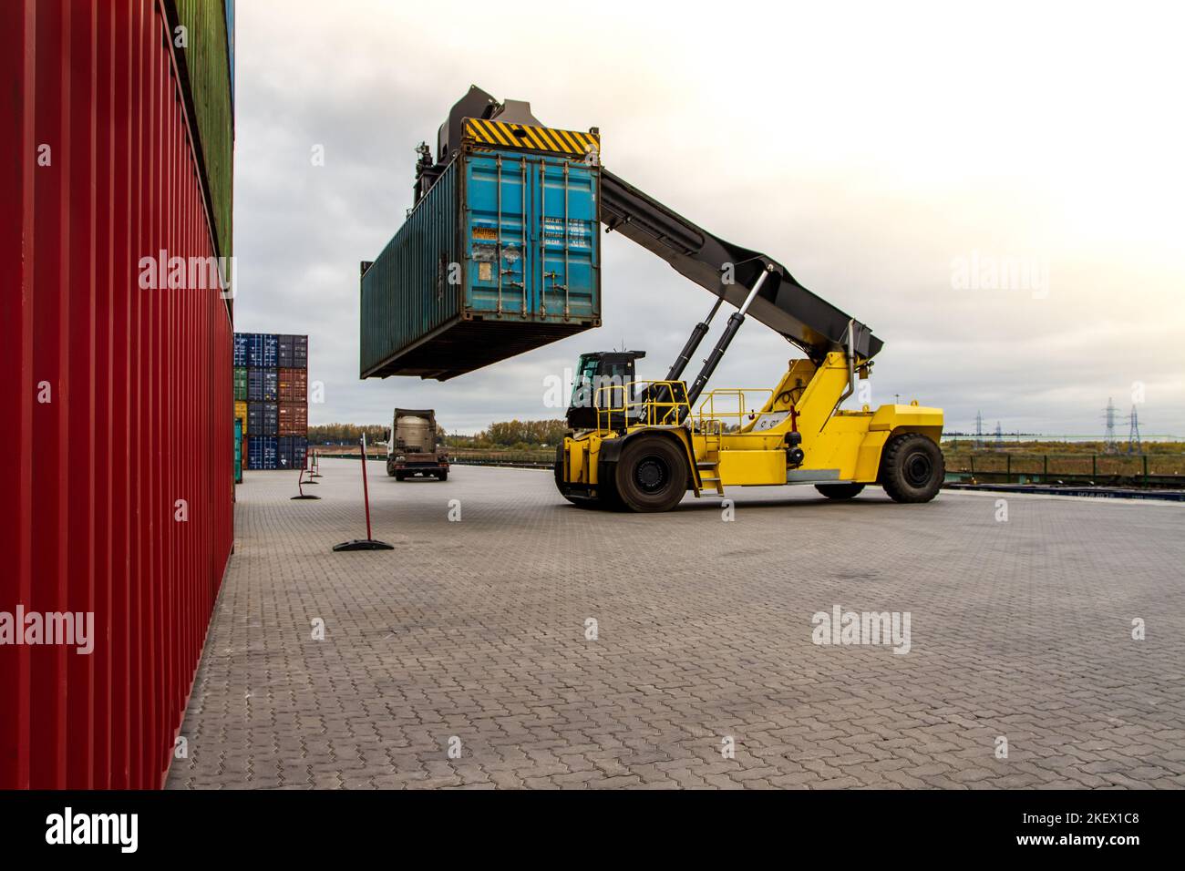 Forklift handling cargo container. Freight container loading. Container ...
