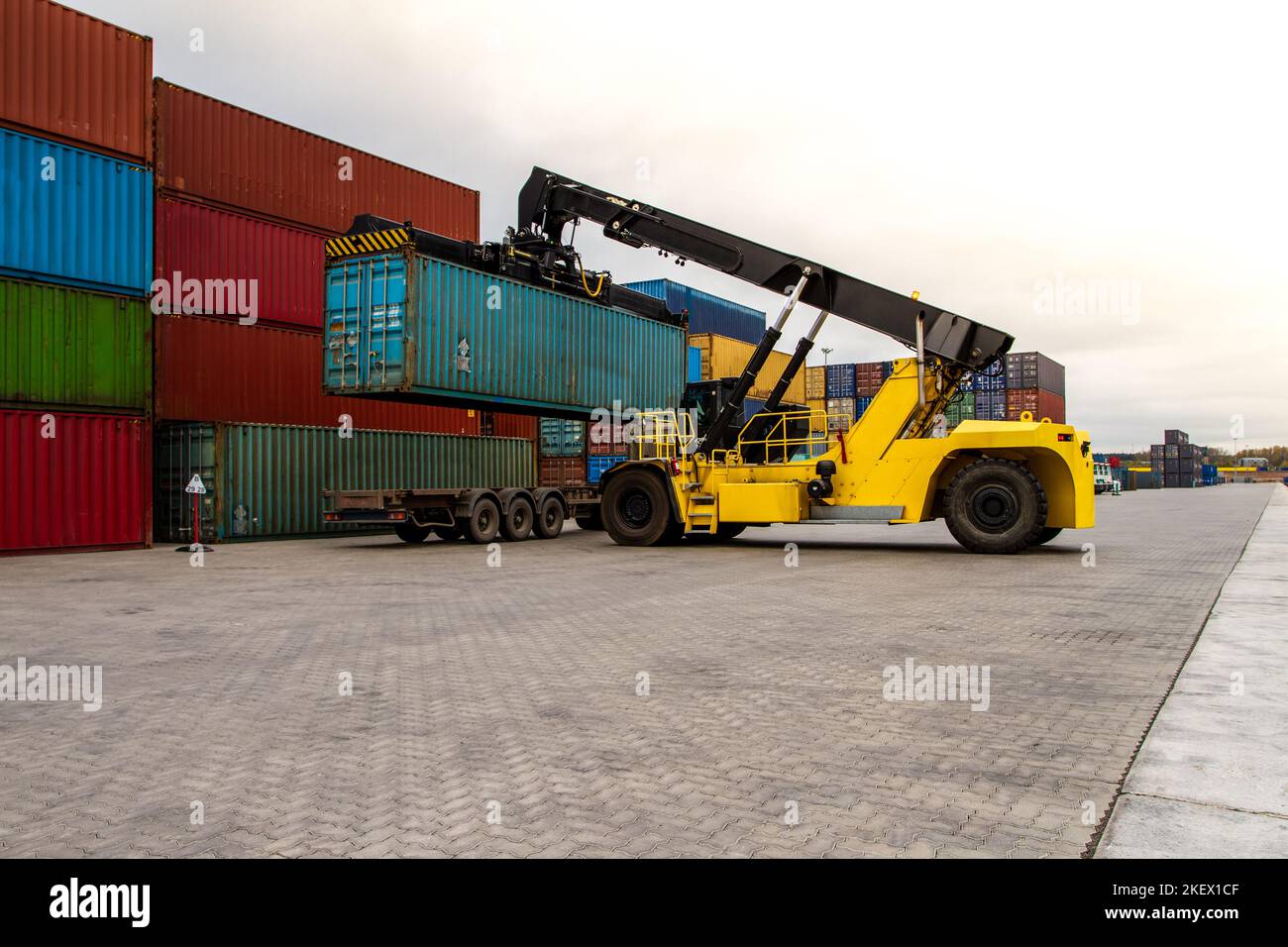 Forklift handling cargo container. Freight container loading. Container ...