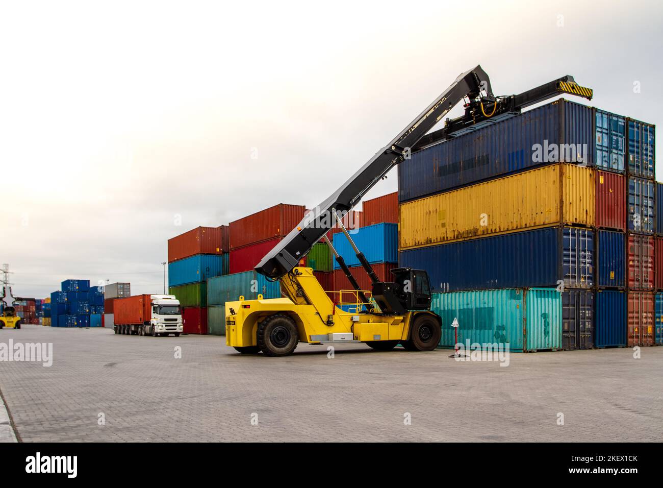 Forklift handling cargo container. Freight container loading. Container ...