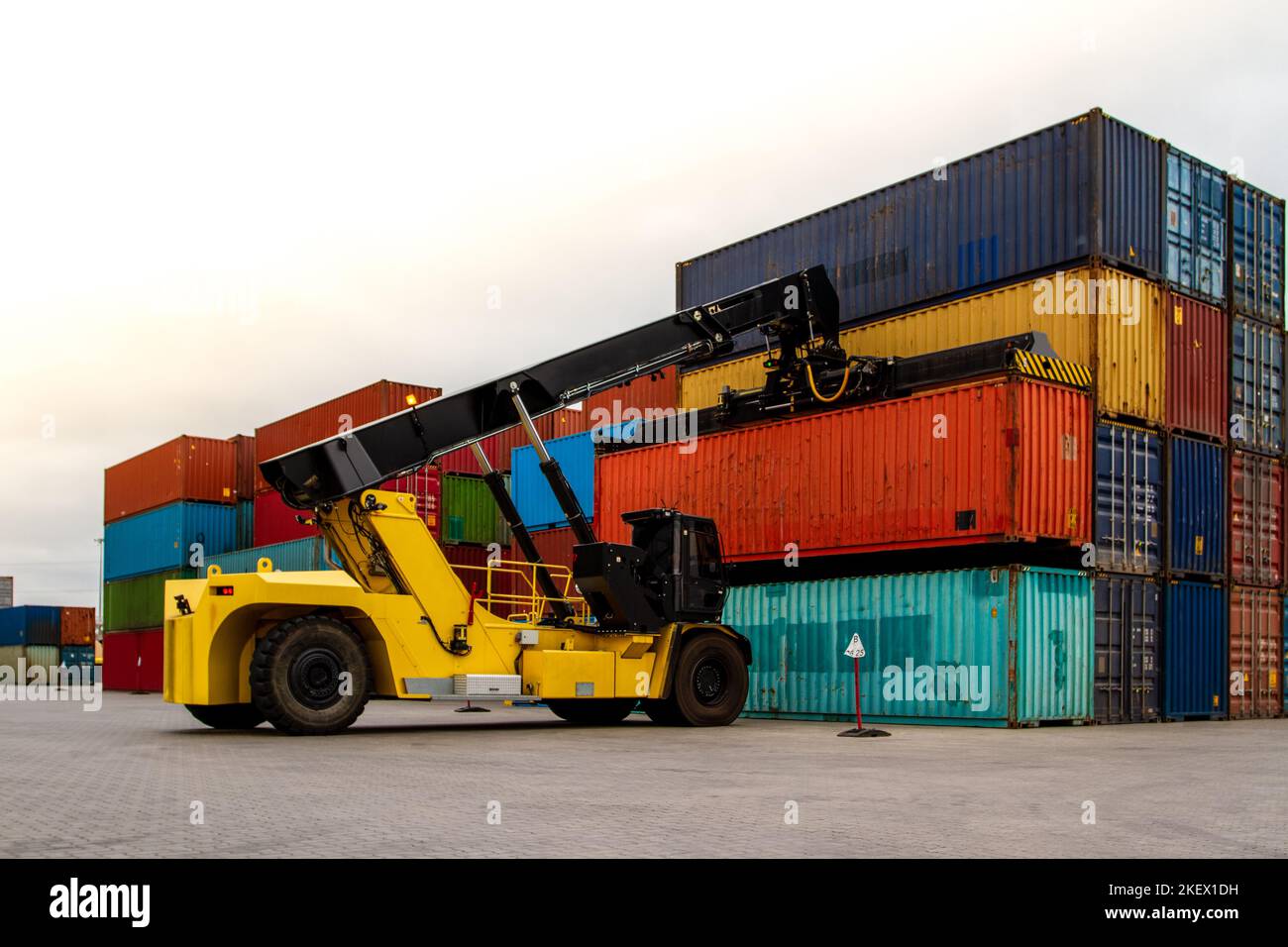 Forklift handling cargo container. Freight container loading. Container ...