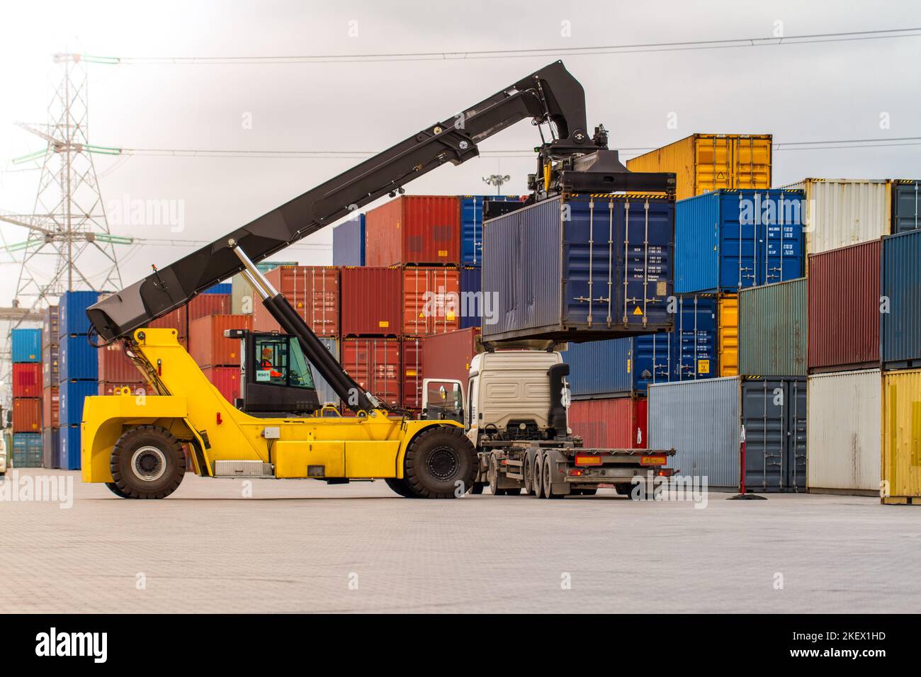 Forklift handling cargo container. Freight container loading. Container ...