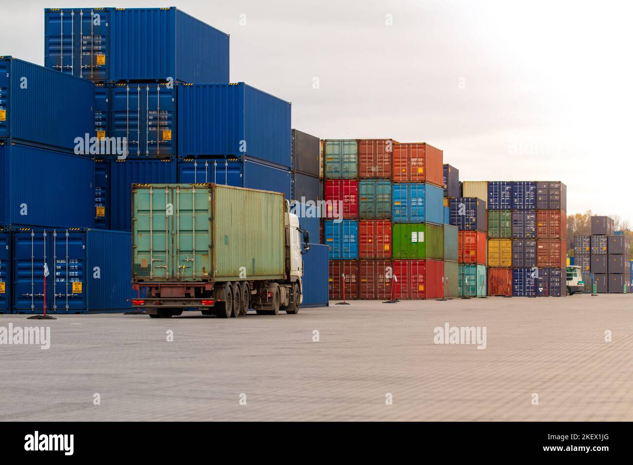 Truck while loading in logistic shipping yard with cargo container ...