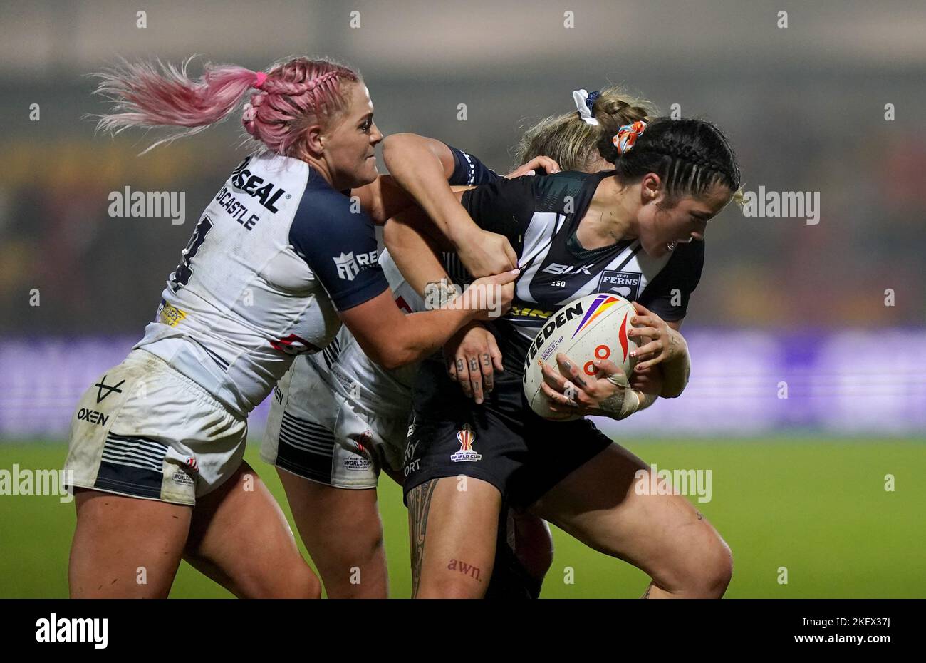 England's Amy Hardcastle (left) tries to tackled New Zealand's Katelyn ...