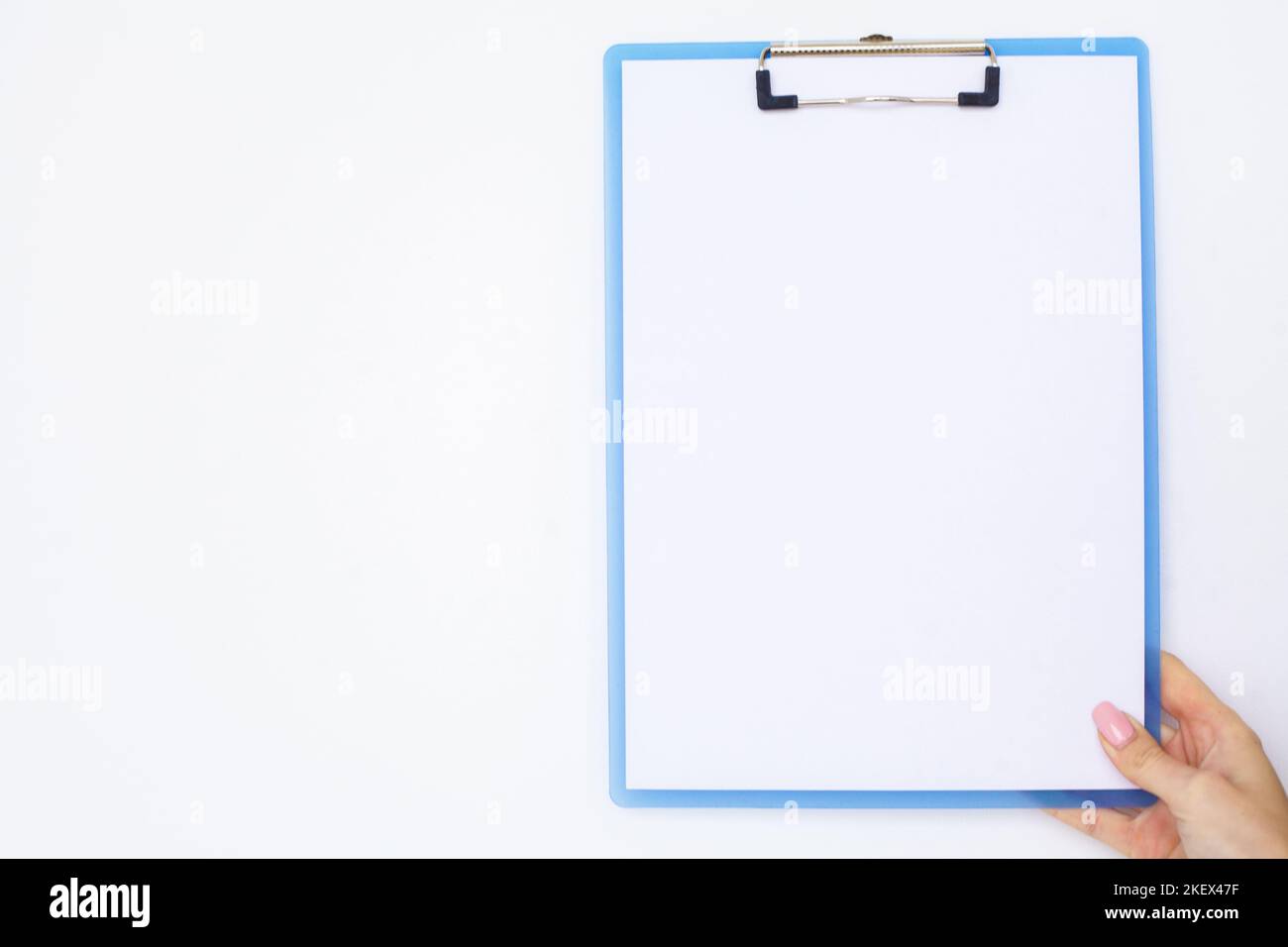 Blank Folder with White Paper. Hand that Holding Folder and Handle on ...