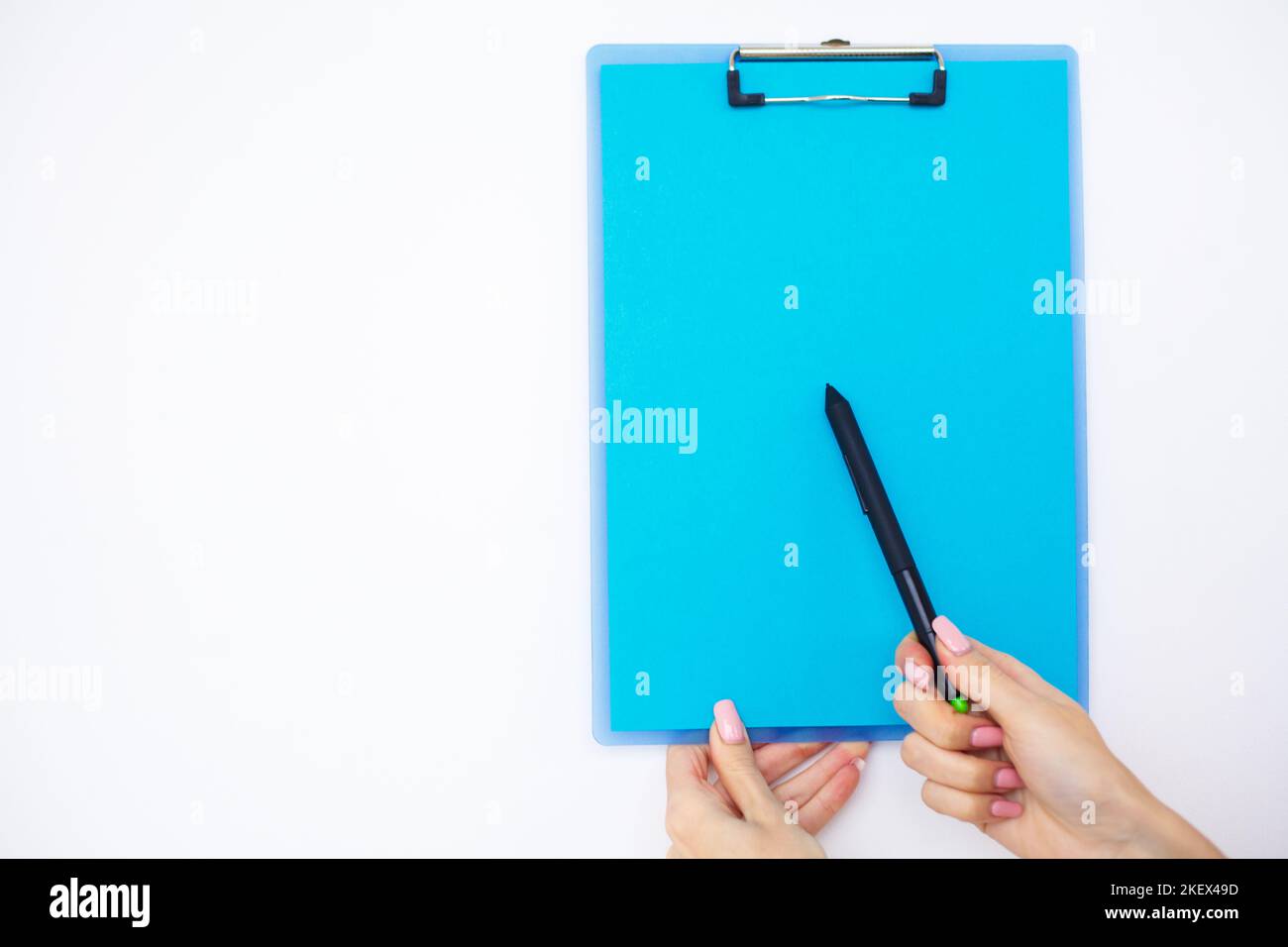 Blank Folder with Blue Paper. Hand that Holding Folder and Pen on White ...