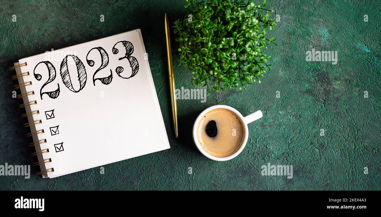 New year resolutions 2023 on desk. 2023 resolutions list with notebook ...