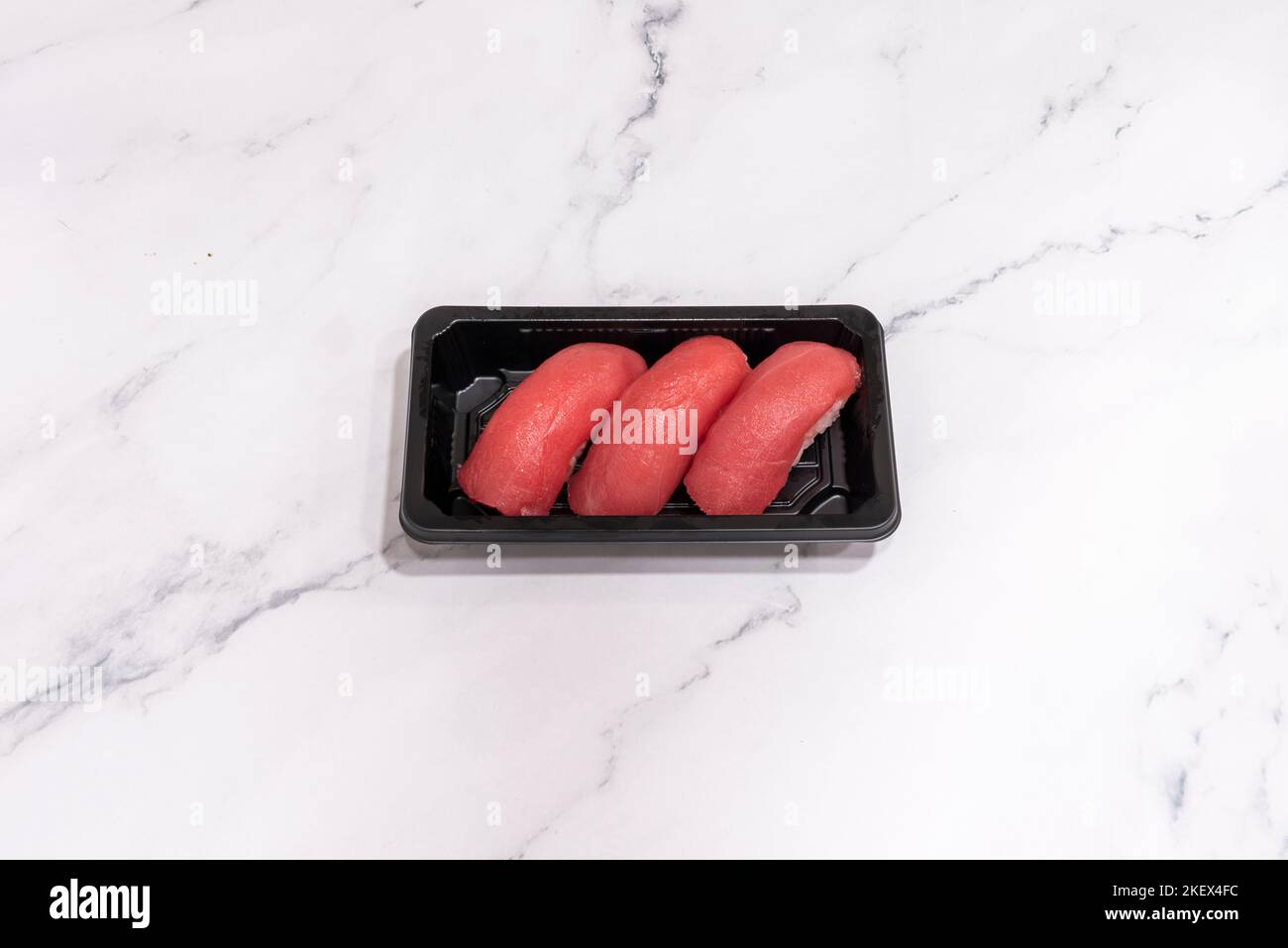 Small Portion Almadraba Bluefin Tuna Nigiris in a Black Shipping ...