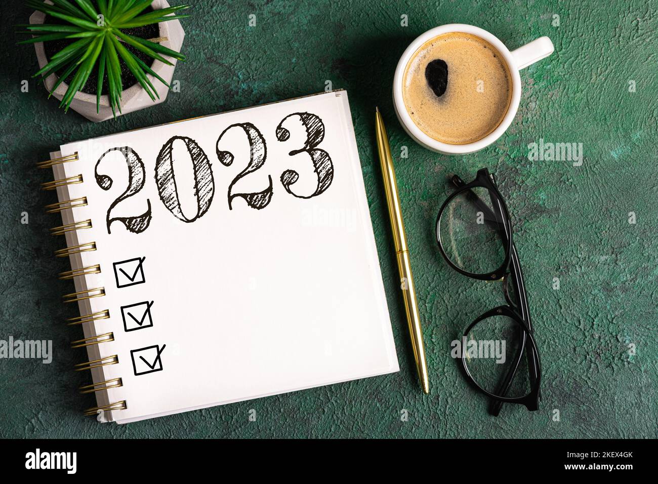 New year resolutions 2023 on desk. 2023 resolutions list with notebook ...