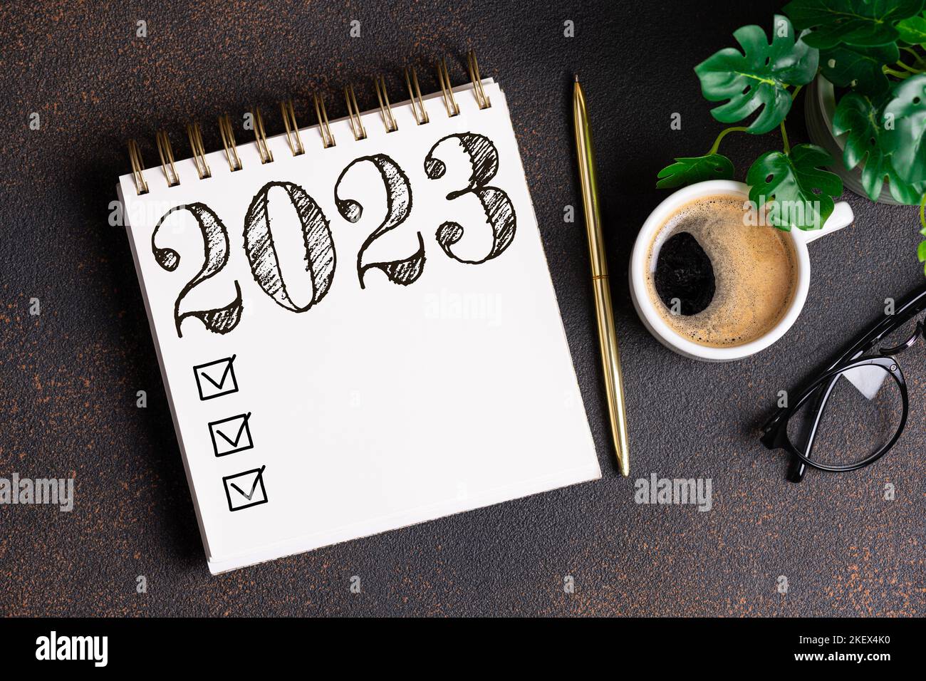 New year resolutions 2023 on desk. 2023 resolutions list with notebook ...