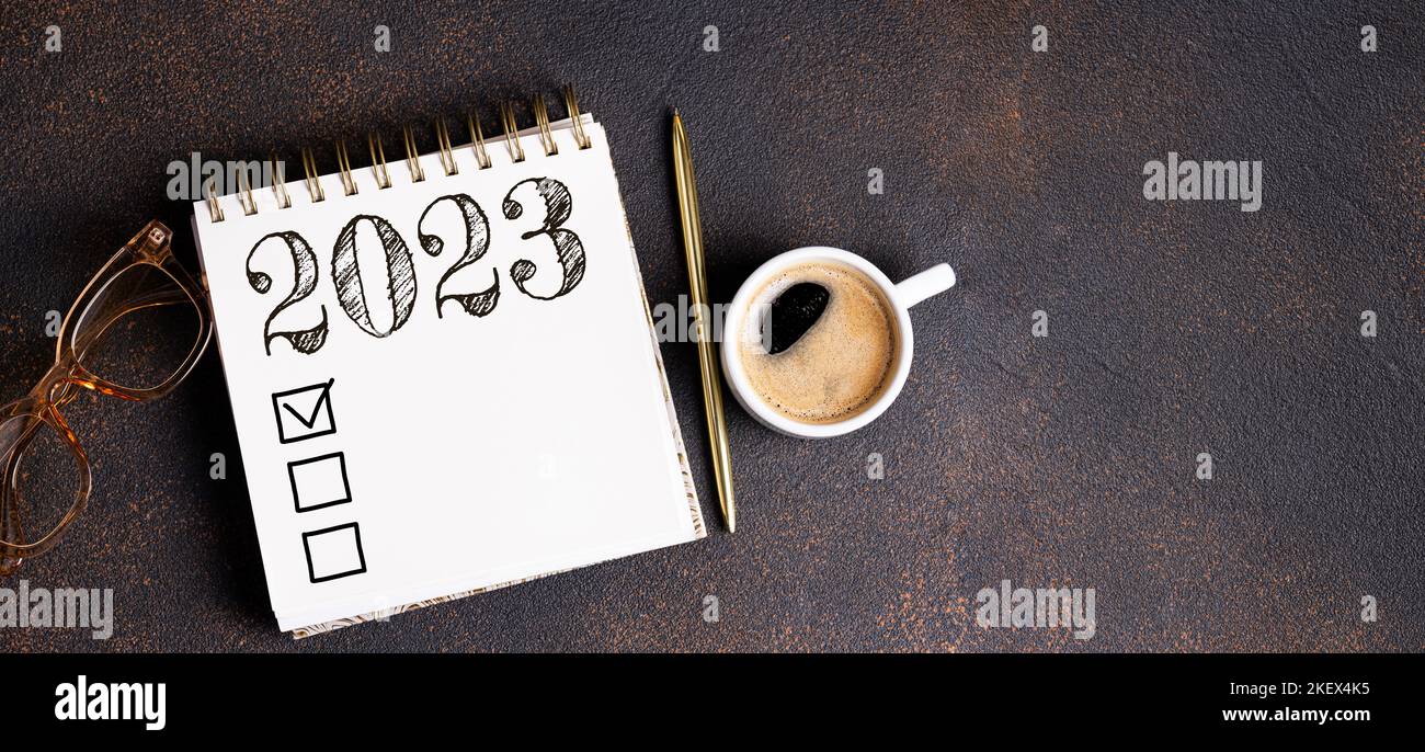 New year resolutions 2023 on desk. 2023 resolutions list with notebook ...