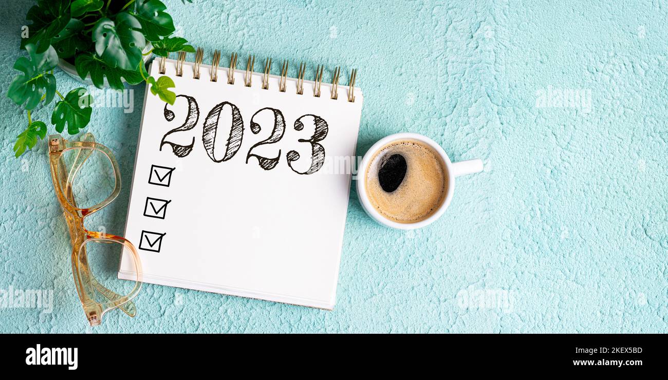 New year goals 2023 on desk. 2023 resolutions list with notebook ...