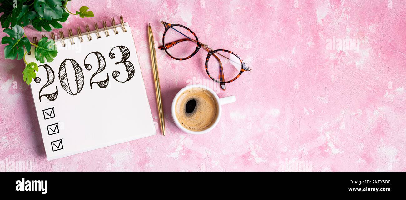 New year resolutions 2023 on desk. 2023 resolutions list with notebook ...