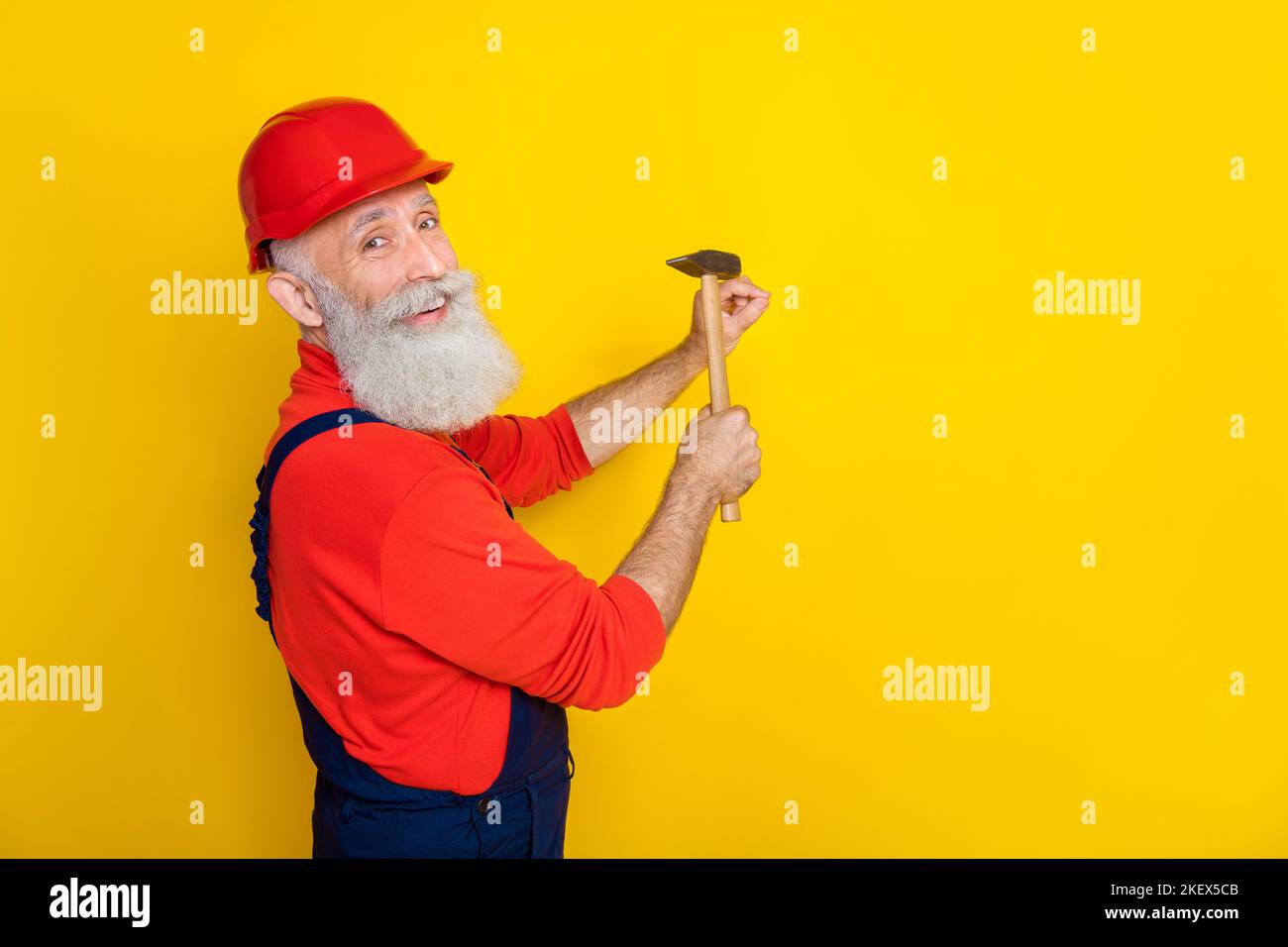 Photo of professional retired pensioner workman architect hammer nail ...