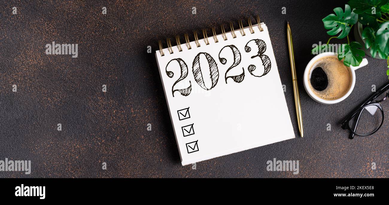 New year resolutions 2023 on desk. 2023 resolutions list with notebook ...