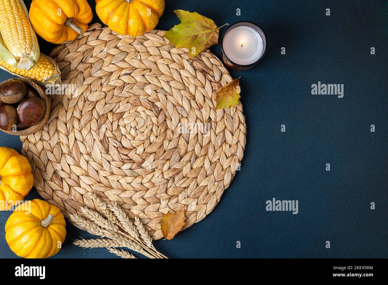 Top view of wicker place mat, pumpkins, harvest, corn, chestnut, autumn ...