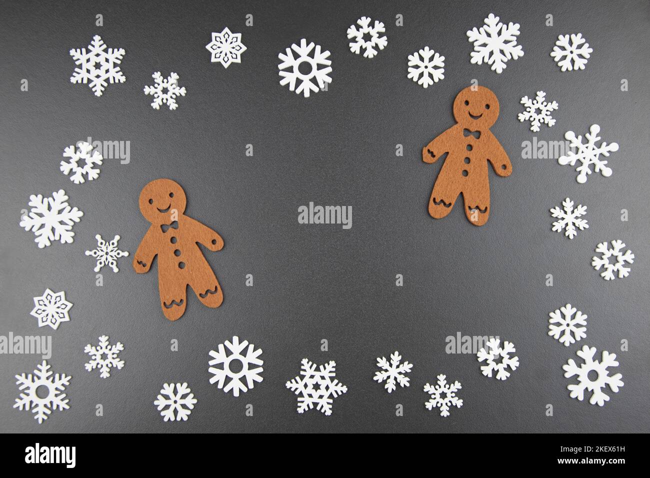 White christmas snowflakes on black background with gingerbread man ...