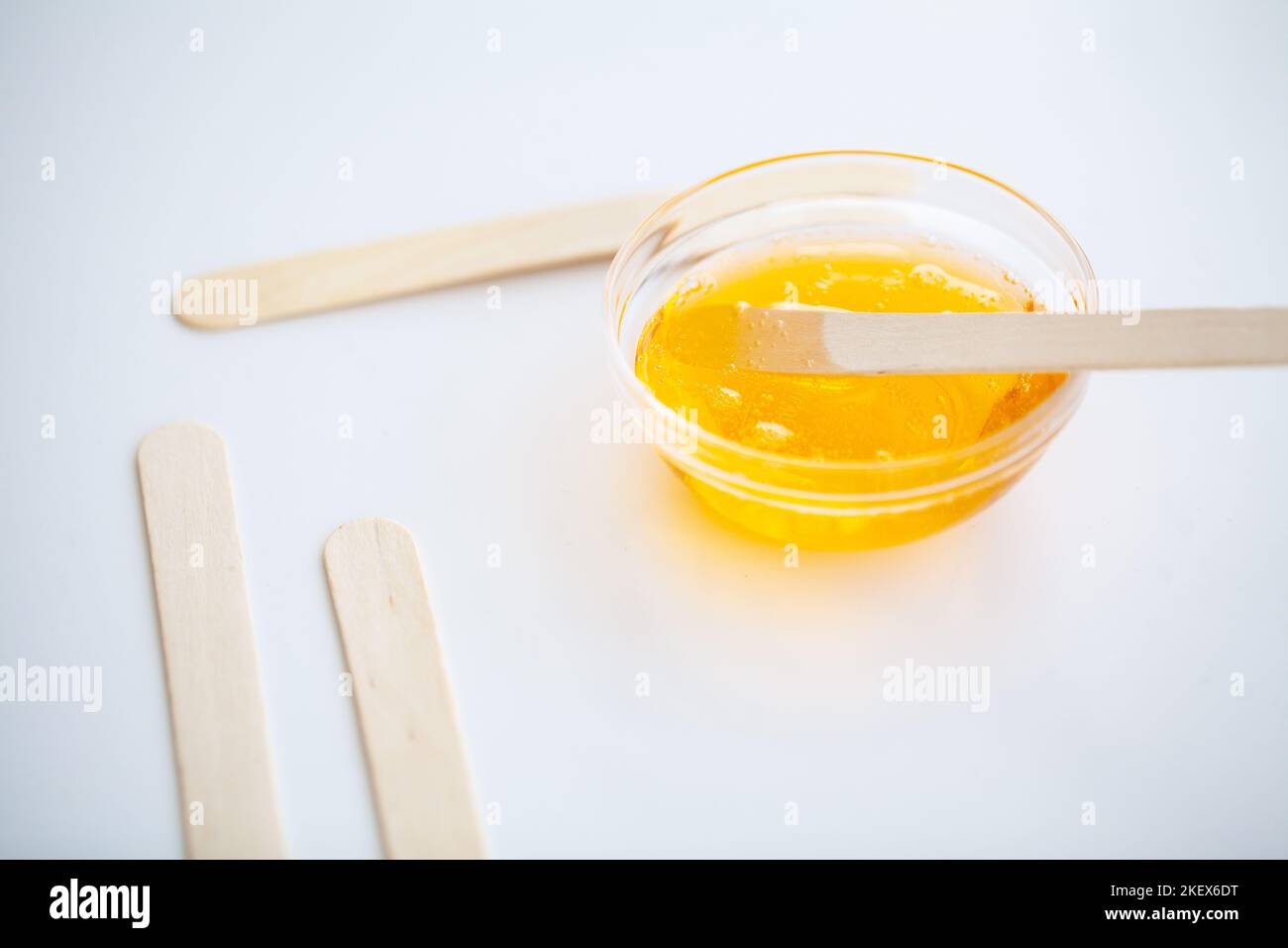 Waxing. Paste for sugaring in beauty salon. Concept depilation with wax ...