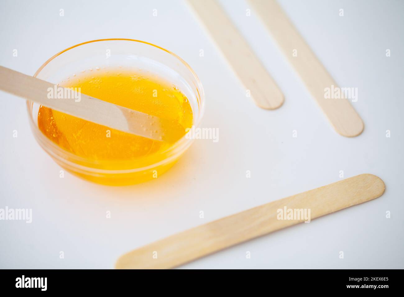 Waxing. Paste for sugaring in beauty salon. Concept depilation with wax ...