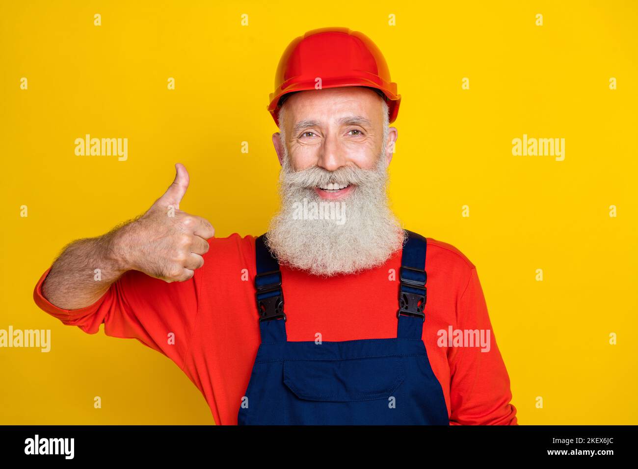 Photo of confident positive age man workwear overall red hard hat ...