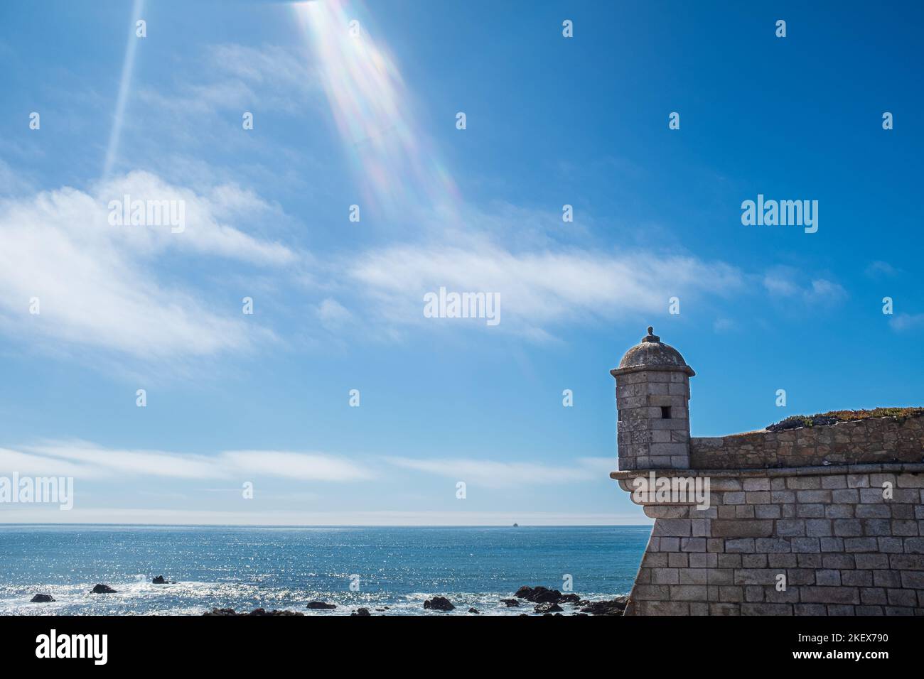 Medieval tower castle landmark at the edge of the Atlantic Ocean on a ...