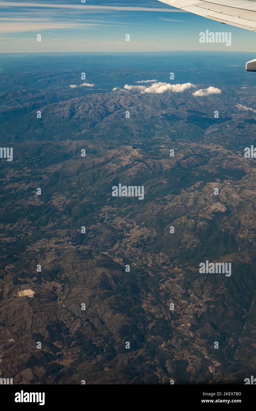 Scenic mountain view from an airplane window while flying across the ...