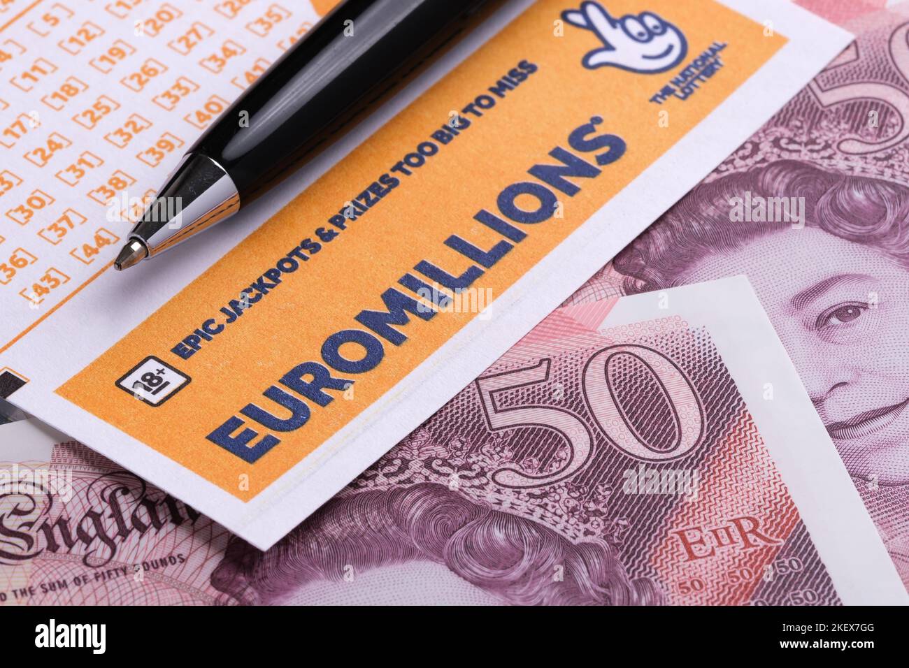 EUROMILLIONS blank lottery tickets, the black pen and 50 pound notes.UK ...