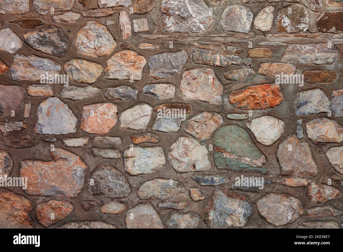 Stonewall background with heavy use of cement. Stone wall made of ...