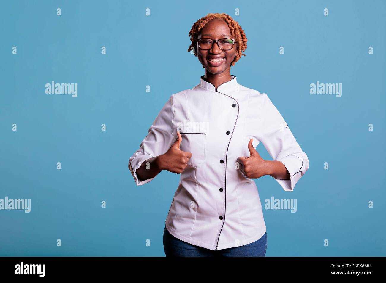 Strong and confident african american chef expressing ok symbol to ...